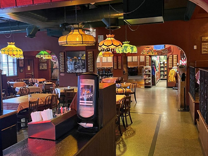 Tiffany-style lamps cast a warm glow over checkered tablecloths, creating that perfect "I've just discovered somewhere special" feeling that makes a meal memorable.