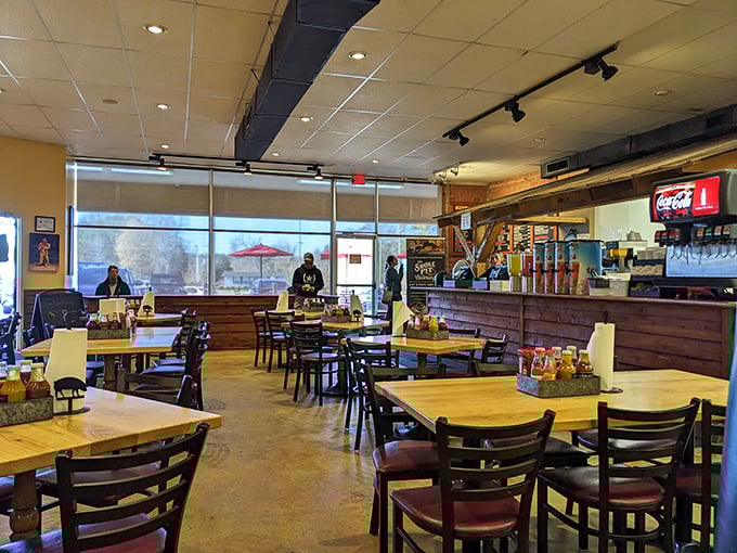 Inside, wooden tables and rustic charm create the perfect backdrop for the smoky drama about to unfold on your plate.