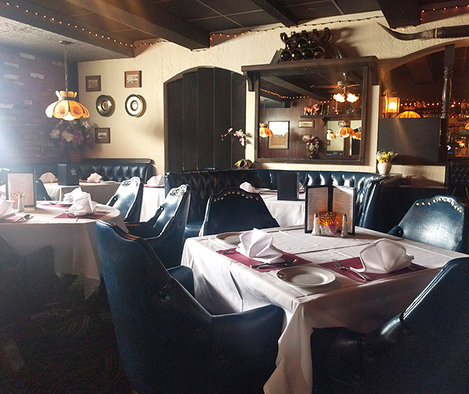 Deep leather booths, white tablecloths, and Tiffany-style lamps create the perfect steakhouse ambiance. This isn't d&eacute;cor&mdash;it's a commitment to dining tradition.