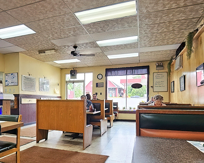 Classic diner booths and warm yellow walls create that "everybody knows your name" atmosphere. No interior designer needed when comfort is the priority.