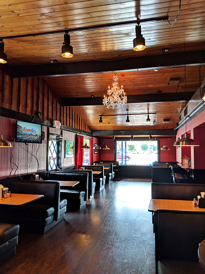 Wood-paneled walls, black booths, and that unexpected crystal chandelier create the perfect maritime-meets-mountains vibe that somehow makes seafood taste even better.