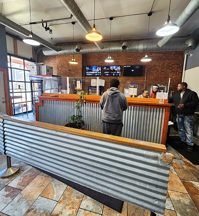 Step inside to industrial-chic simplicity: corrugated metal, exposed brick, and pendant lighting that says, "We're serious about the food, not the frills."