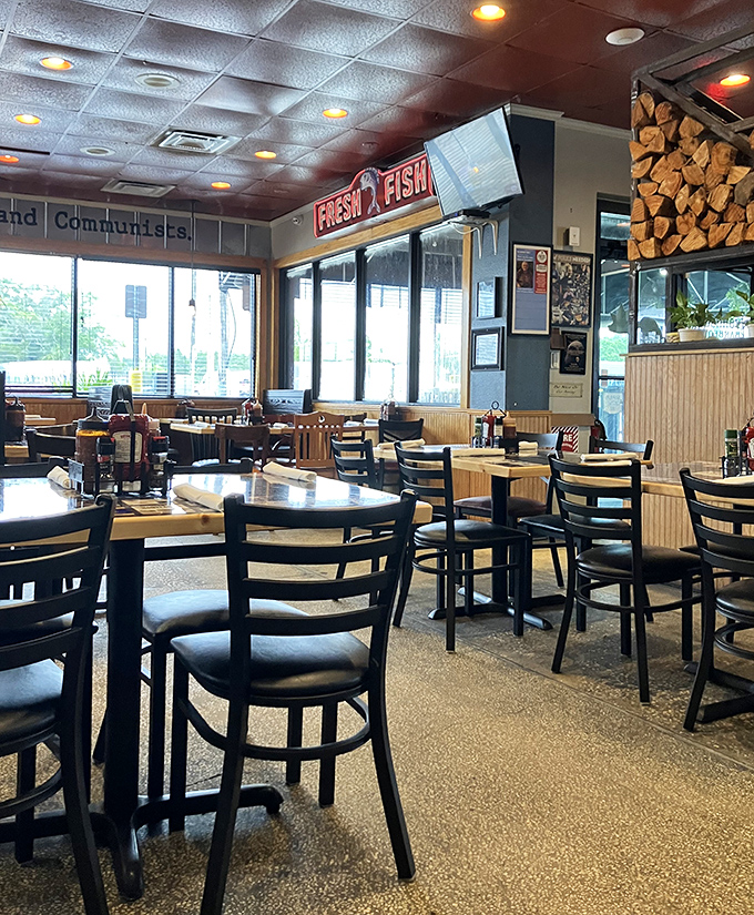 Inside, the dining room balances no-nonsense functionality with genuine character&mdash;note the firewood stack, a not-so-subtle hint about their cooking methods.