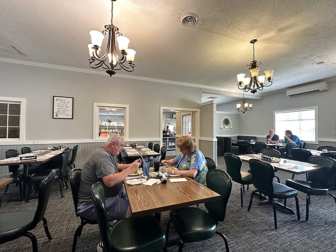 The dining room's simple elegance lets you focus on what matters—the food. Those chandeliers have witnessed countless "mmm" moments.