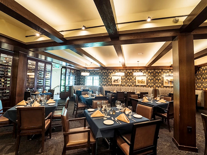 Exposed wooden beams and patterned wallpaper create that rare dining atmosphere where "fancy" somehow feels like coming home.
