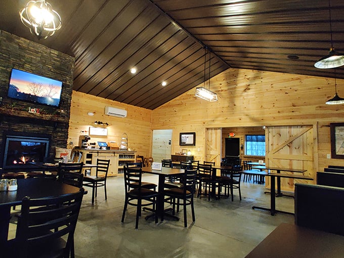 Step inside and the warm pine walls embrace you like an old friend, while that stone fireplace promises cozy comfort on chilly Pennsylvania evenings.