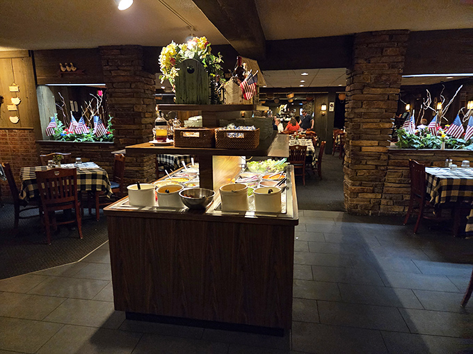 Classic supper club ambiance with stone pillars and checkered tablecloths. This isn't d&eacute;cor&mdash;it's a time machine to when dining was an event.