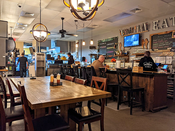 Inside, rustic wooden tables and globe pendant lights create that perfect "come as you are" atmosphere where the only dress code is bringing your appetite.
