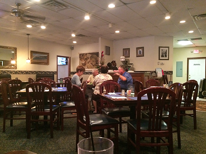 Inside Canal Grille, wooden chairs and warm lighting create that "everybody knows your name" atmosphere that's increasingly rare in today's dining scene.