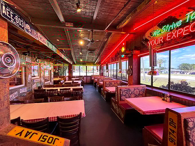 Red neon casts its glow over checkered tablecloths and license plate-adorned walls. This isn't ambiance&mdash;it's a time machine to when restaurants had personality.