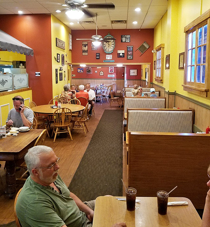 Warm yellow and red walls adorned with vintage memorabilia create that perfect "everybody knows somebody" atmosphere where conversation flows as freely as the coffee.