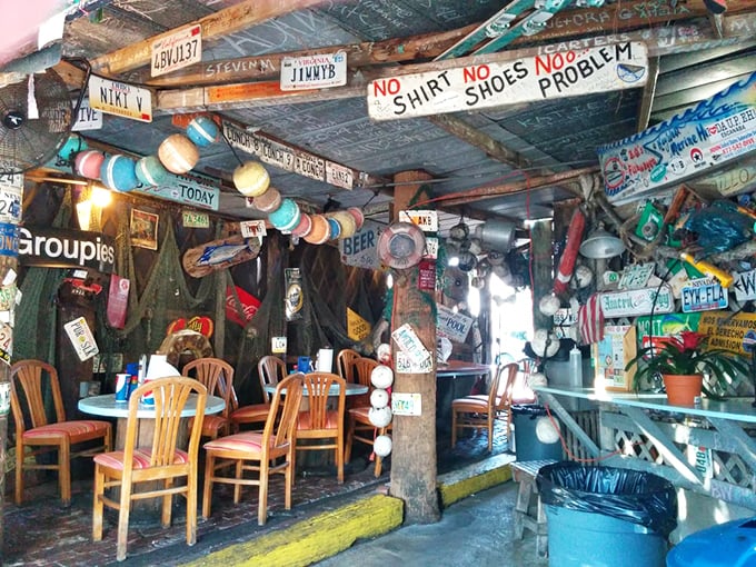 "No Shirt, No Shoes, No Problem" isn't just a sign&mdash;it's a philosophy. Every inch of ceiling space tells a story of visitors past.