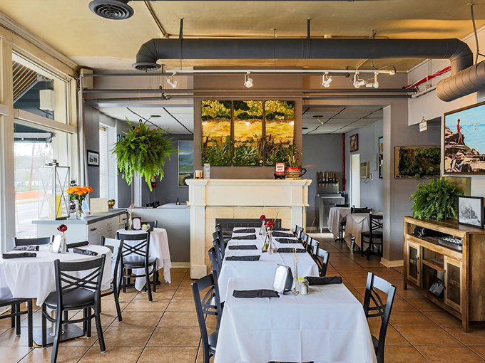 Inside, white tablecloths meet exposed ductwork in a space that balances rustic charm with unexpected elegance. That fireplace isn't just for show&mdash;it's warming souls and appetites alike. 