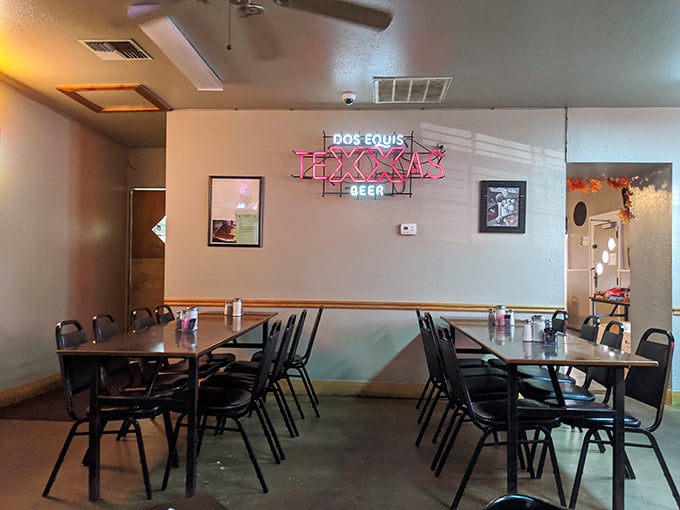 Inside, simple tables and neon beer signs create that perfect "no fuss, all flavor" atmosphere where the food, not the decor, does the talking.