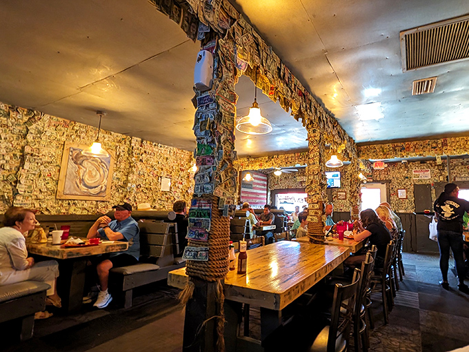Dollar bills wallpaper every surface like a seafood-scented Federal Reserve. Each one tells a story—most involving someone saying "best oysters I've ever had!"