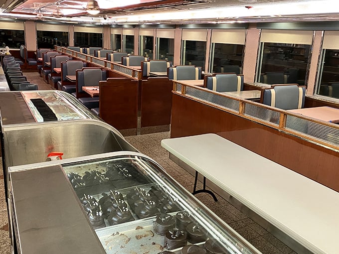 Classic blue booths line the walls like old friends waiting for a reunion. This is where memories are made, one bottomless coffee at a time. 