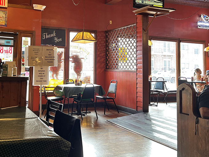 Red walls, wooden lattice dividers, and checkered tablecloths &ndash; the unpretentious dining room where barbecue dreams come true.