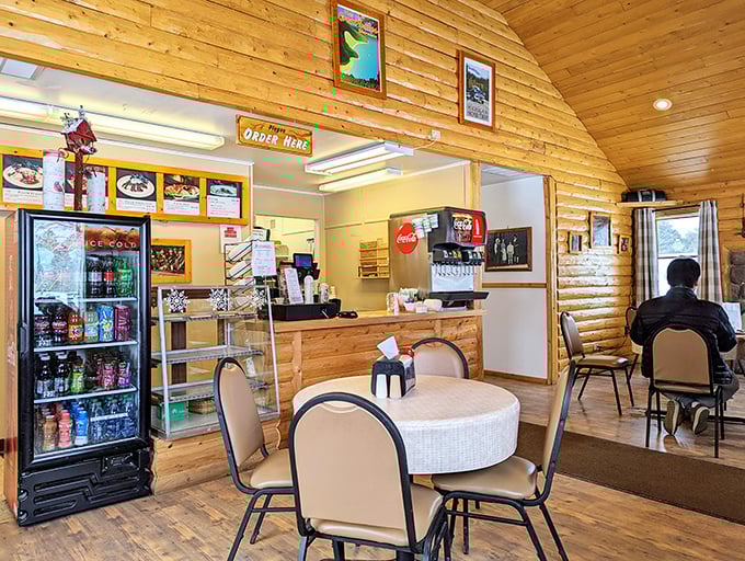 Wood-paneled warmth meets small-town charm in a space that feels like your favorite aunt's kitchen got a restaurant license.