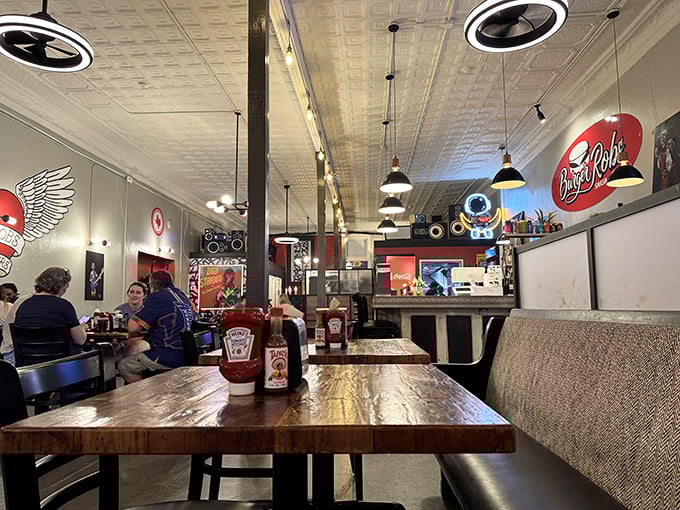Inside, the pressed tin ceiling and pendant lighting create a space that feels both nostalgic and current&mdash;like comfort food reimagined for today's palate.