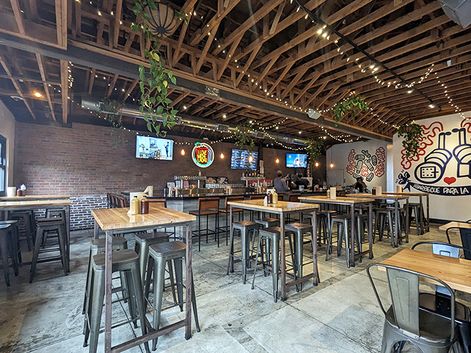 Industrial-chic meets barbecue comfort under exposed beams and twinkling lights. The smell of smoked meat makes these wooden tables the most coveted real estate in Los Angeles.