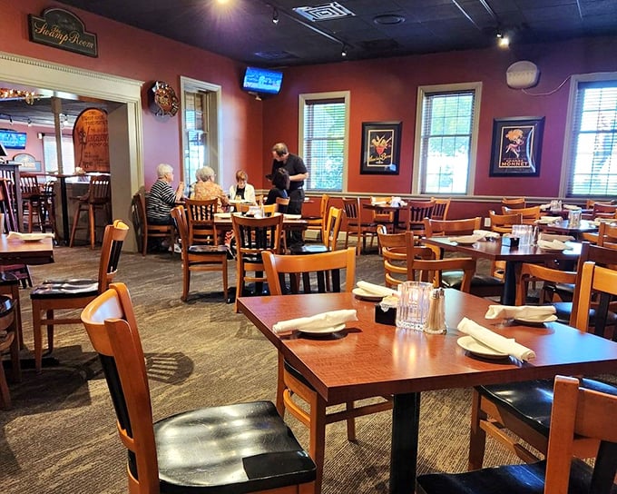 Warm burgundy walls and wooden furnishings create that perfect "everybody knows your name" vibe. Cheers to places that feel like a hug!