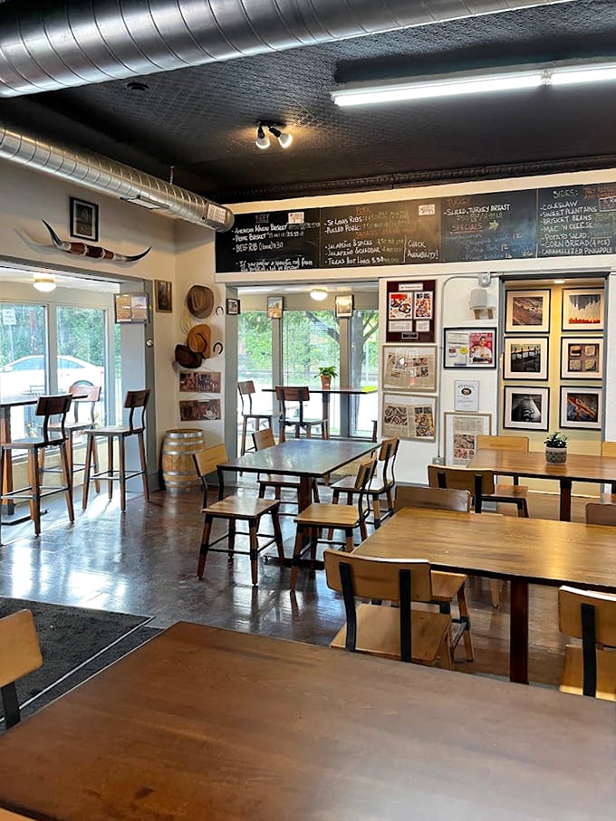 Industrial chic meets barbecue soul - where exposed ductwork and warm wood create the perfect smokehouse atmosphere.