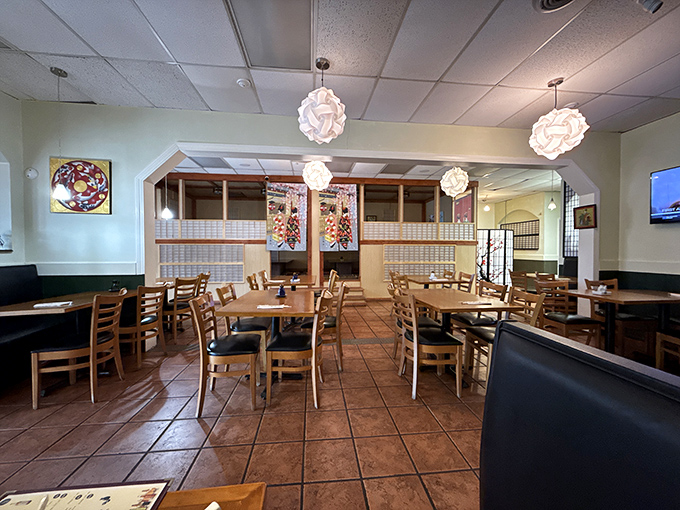 Paper lantern fixtures cast a warm glow over wooden tables, creating that perfect "not too fancy, not too casual" vibe where both first dates and family dinners thrive.