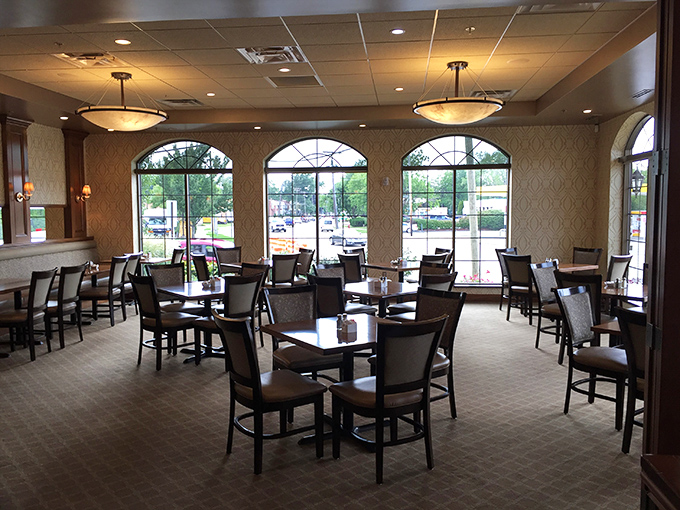 Sunshine streams through arched windows, illuminating a dining room where comfort meets class—the perfect backdrop for sandwich perfection.