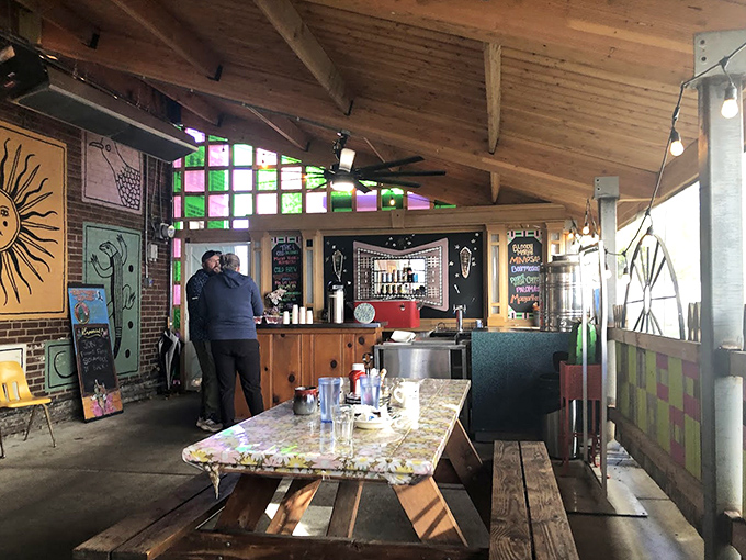 Inside, wooden beams and colorful stained glass create a space that feels like New Mexico gave Missouri a warm, artistic hug.