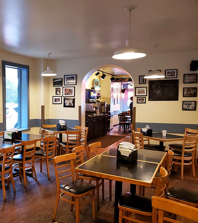 Wooden tables, cream walls with blue trim, and an archway that might as well be labeled "Gateway to Deliciousness."