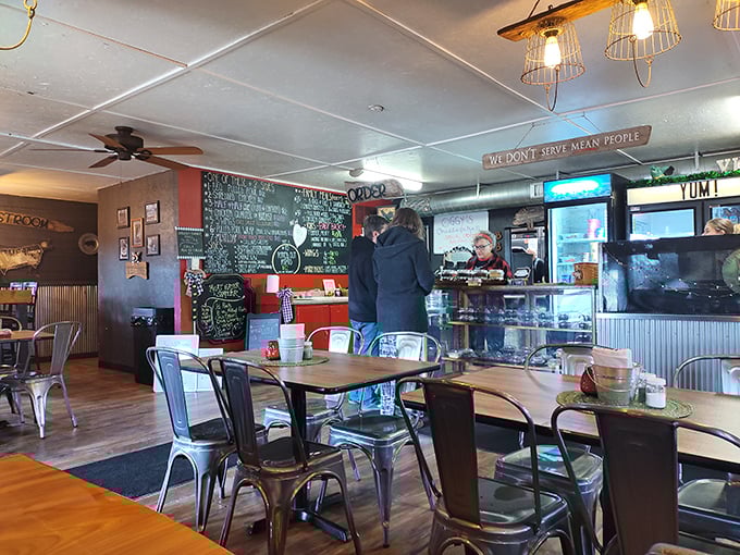 Inside, the "We Don't Serve Mean People" sign isn't just decor&mdash;it's a philosophy that pairs perfectly with metal chairs, wooden tables, and chalkboard menus.