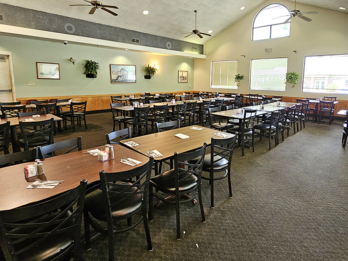 Where kitchen magic happens in plain sight. The wooden chairs and motivational signs aren't d&eacute;cor choices&mdash;they're promises of comfort to come.