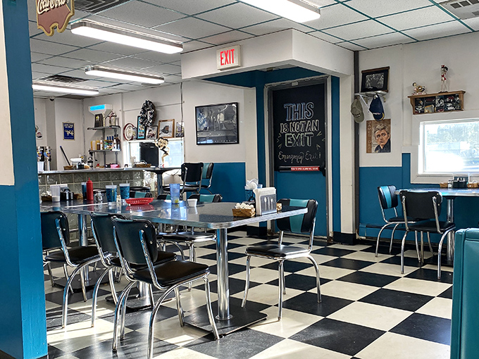 Black and white checkered floors meet turquoise accents in this time capsule of Americana, where that "THIS IS NOT AN EXIT" sign might be the truest statement ever made.