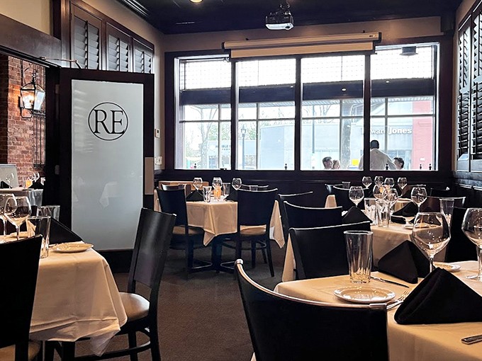 White tablecloths, dark wood, and that perfect lighting that makes everyone look like they've just returned from vacation&mdash;Rick Erwin's dining room nails the upscale-yet-comfortable vibe.