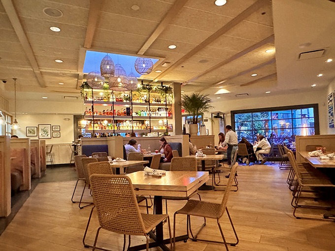 Inside, the warm glow of Pacific Catch's bar illuminates conversations and coastal dreams. It's where "I'll just have one drink" turns into "let's see the dessert menu."