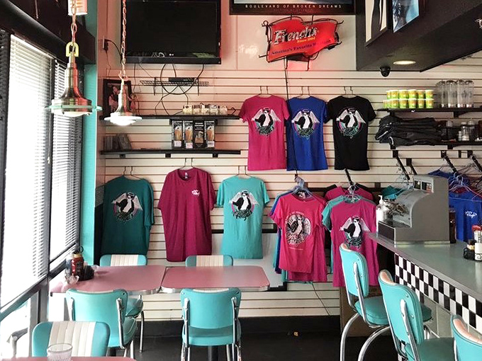 Step into a time machine of turquoise and pink! The diner's vibrant interior and branded merch create a 50s wonderland worth the drive.
