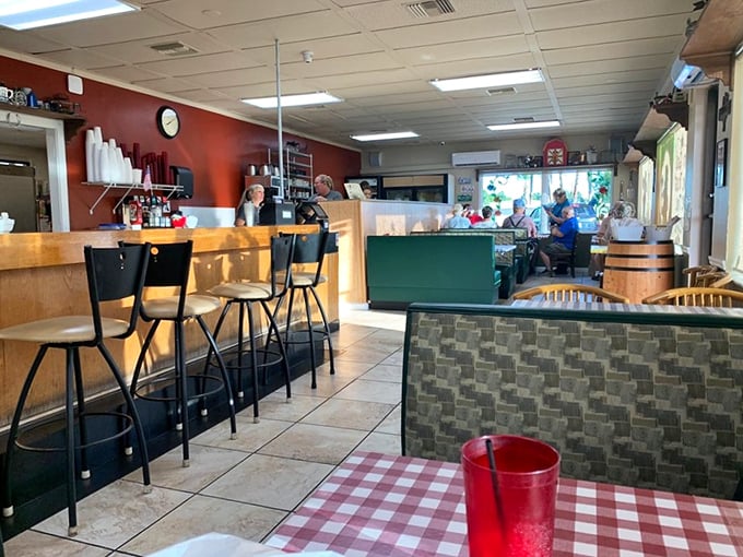 Inside, red walls and checkered tablecloths create that "grandma's kitchen" vibe where calories don't count and coffee refills flow freely.