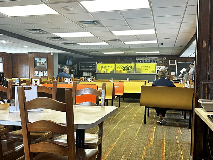 Step inside and time travel to a bygone era where yellow booths and wood paneling create the perfect backdrop for memorable meals and conversations.