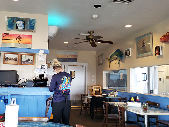 Inside, coastal charm meets casual comfort with nautical touches and that unmistakable "we caught it this morning" seafood restaurant vibe.