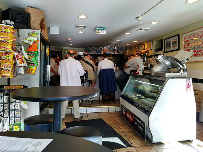 The lunchtime rush at Vincenzo's &ndash; where patience isn't just a virtue, it's the price of admission for sandwich perfection.