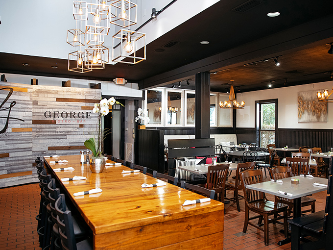 Inside, geometric lighting fixtures hover above warm wooden tables, creating an atmosphere that says "yes, we're serious about food, but we don't take ourselves too seriously."