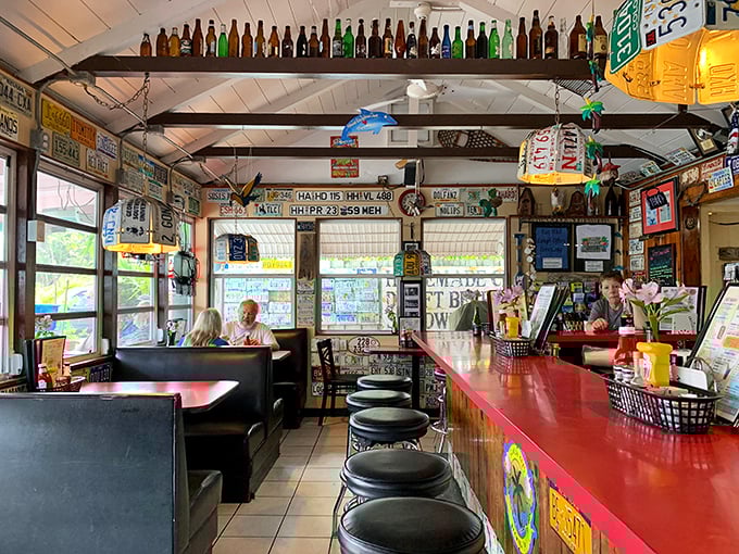 License plates, bottles, and memories line every inch of this quintessential Keys joint. It's like dining inside a scrapbook of American road trips.