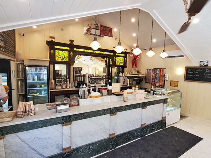 The vintage-inspired counter area blends old-school soda fountain charm with stained glass accents that filter the Florida sunshine.