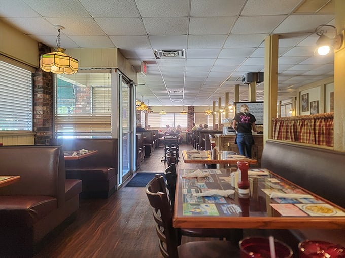 Classic diner ambiance with a Florida twist&mdash;Tiffany-style lamps cast a warm glow over booths where breakfast dreams come true.
