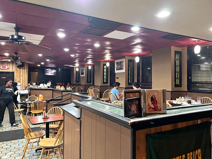 Inside Big Mike's, the warm wood paneling and red ceiling create that perfect "come as you are" atmosphere where comfort food meets comfortable surroundings.