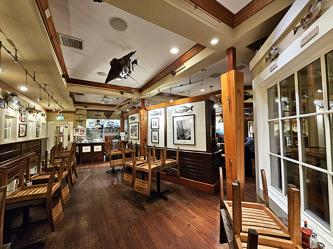 Warm wooden tones and nautical touches transform this dining room into a sailor's dream, where every seat promises both comfort and maritime charm.