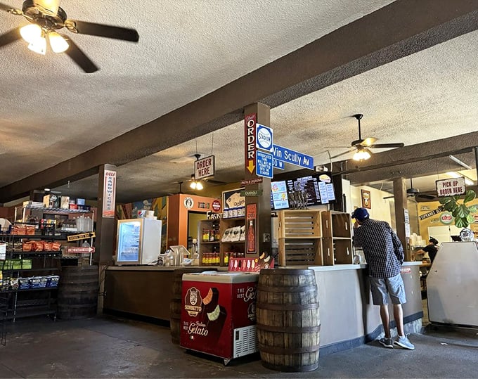 Inside, time stands still as ceiling fans whirl above wooden barrels and vintage signage &ndash; the stage is set for sandwich magic to unfold.