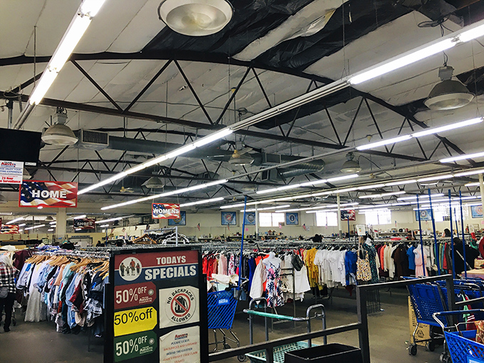 Beneath industrial ceilings, a sea of clothing racks stretches toward the horizon&mdash;color-coded sections creating a roadmap for retail adventurers.