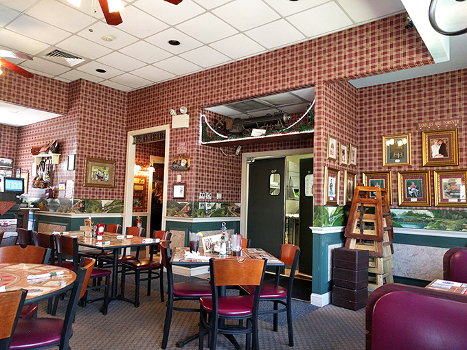 Red checkered walls, wooden chairs, and train-themed d&eacute;cor create that perfect "I've discovered somewhere special" atmosphere that makes you want to become a regular.