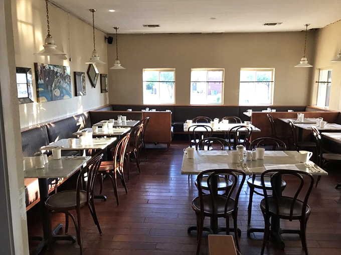 Classic bentwood chairs and marble-topped tables create that perfect sweet spot between "fancy enough for a celebration" and "comfortable enough for Tuesday morning."